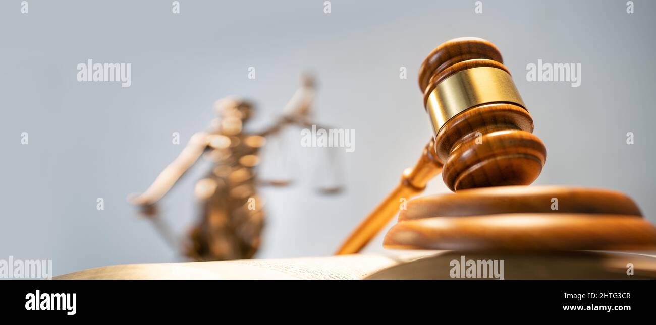 Statue of lady justice on bright background - Side view with cop Stock ...