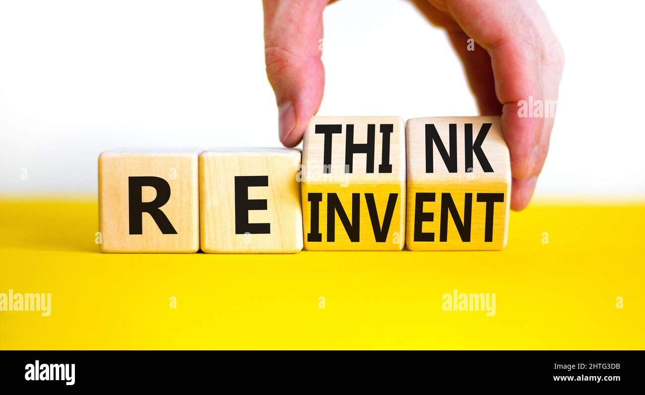 Reinvent and rethink symbol. Businessman turns cubes and changes the ...