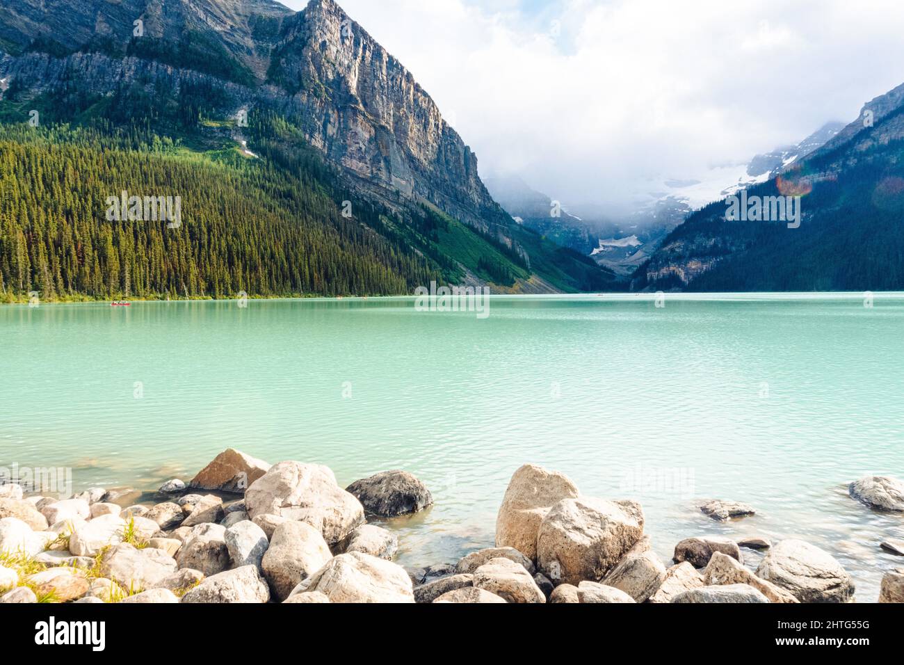 Beautiful view of the Louise Lake and the mountains with forest in ...