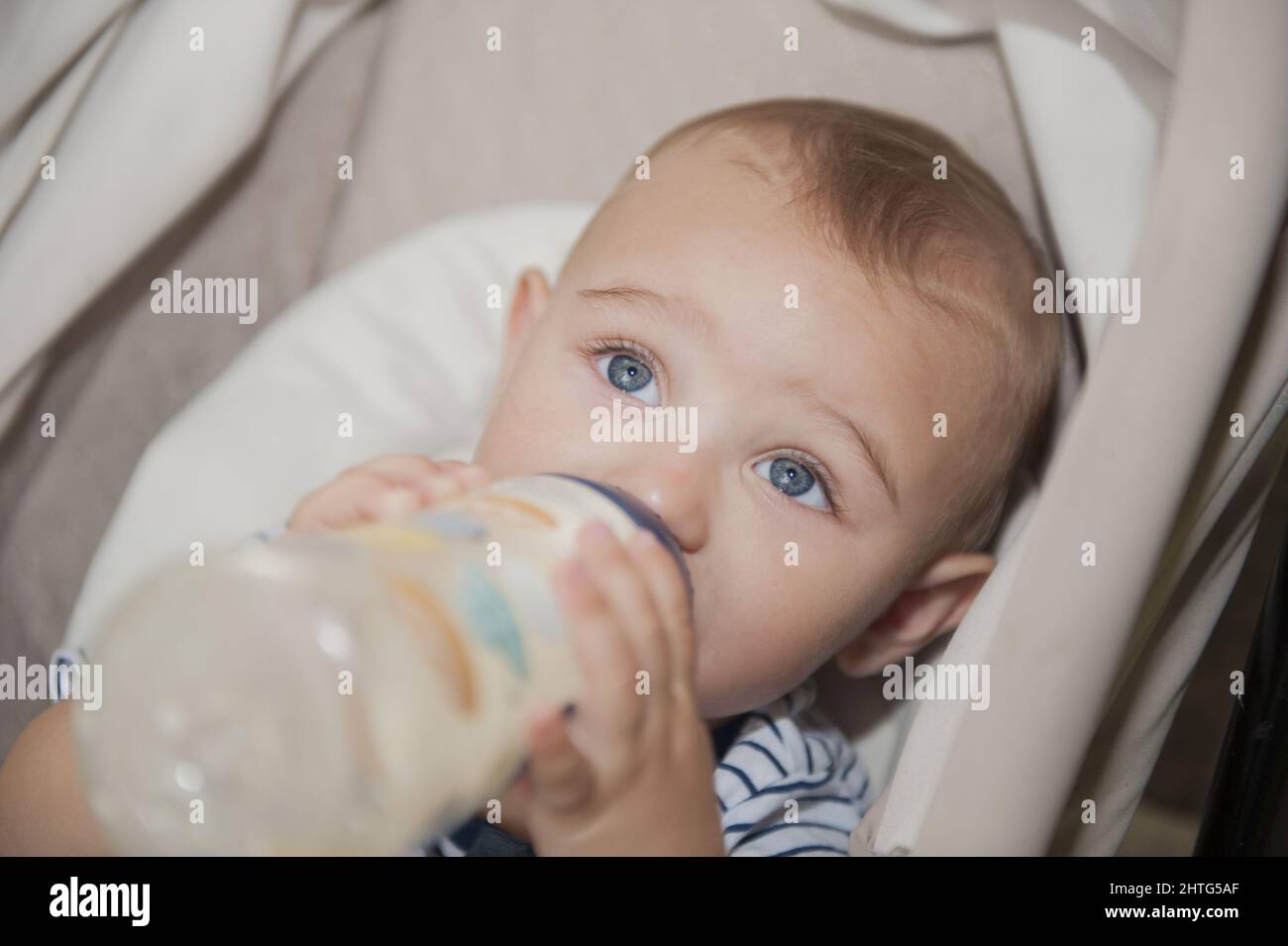 Child drinking milk bed hi-res stock photography and images - Alamy