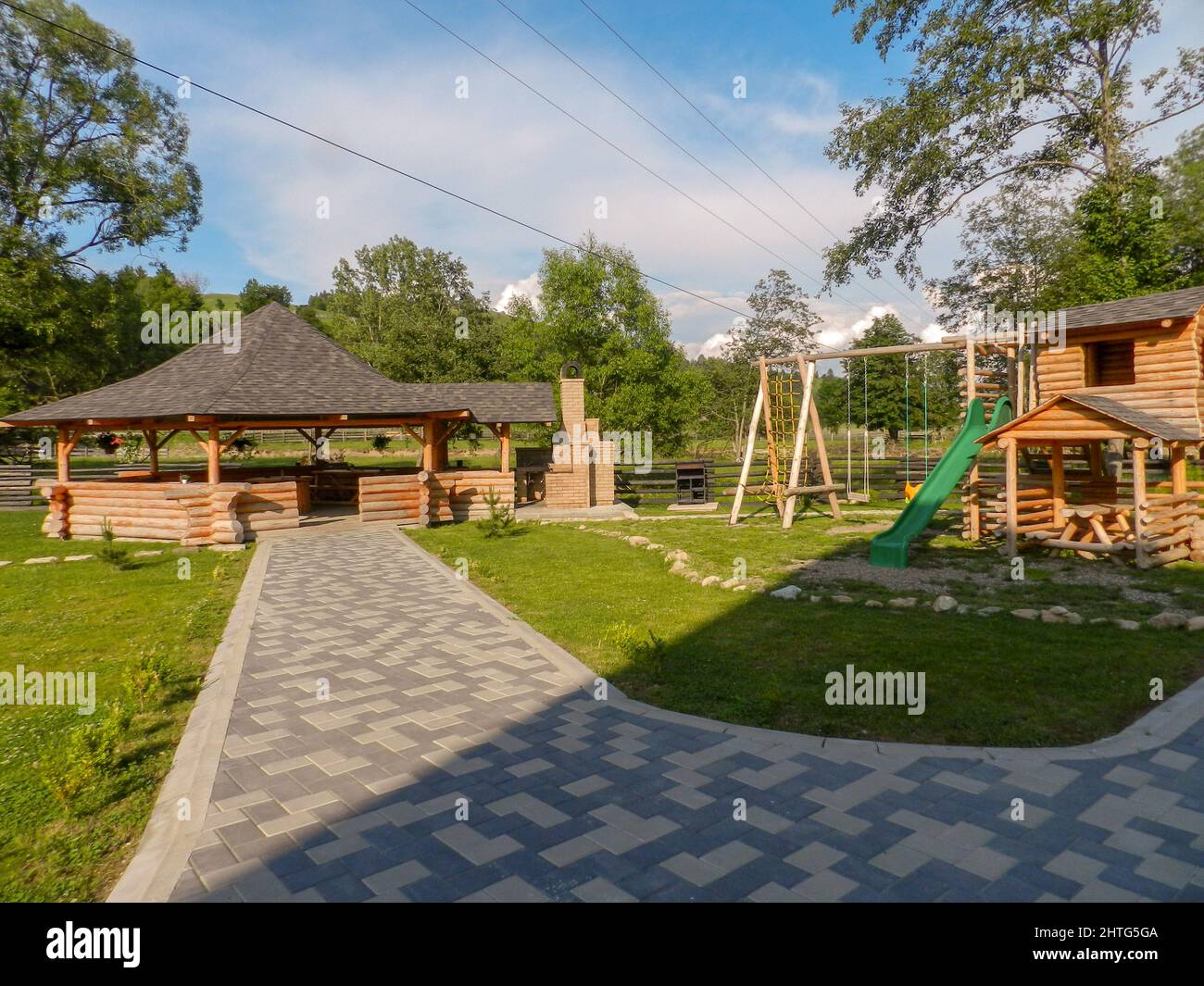 Beautiful playground with wooden pavilions and a pathway Stock Photo ...