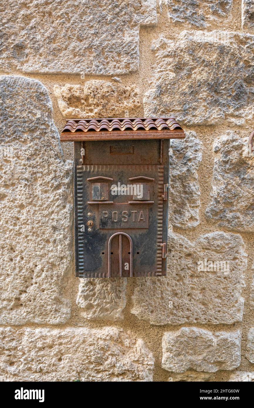 Vertical shot of an old rusty mailbox on the wall in Onano, Italy Stock ...