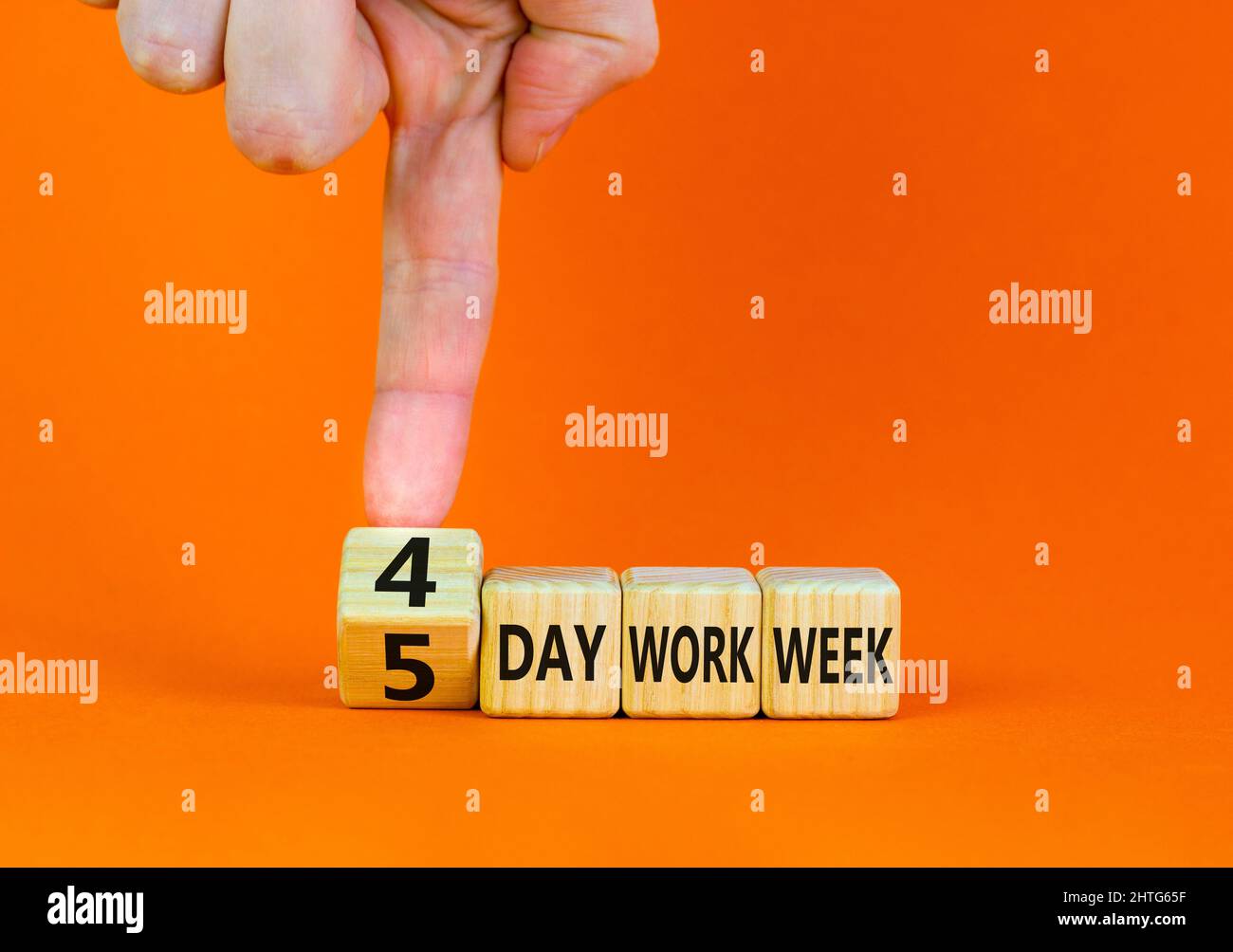 4 or 5 day work week symbol. Businessman turns cubes and changes words ...