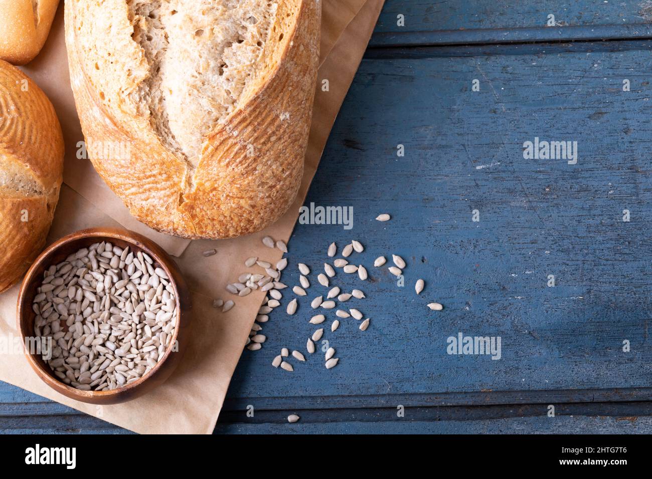 Close up view of different types of breads and pumpkin seeds with copy ...
