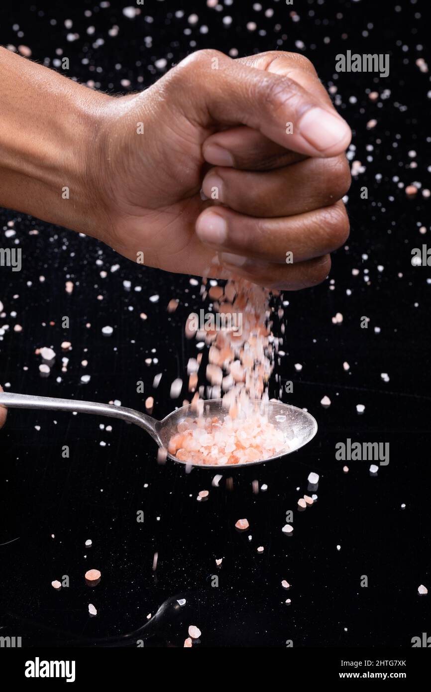 African american hand salt hi-res stock photography and images - Alamy