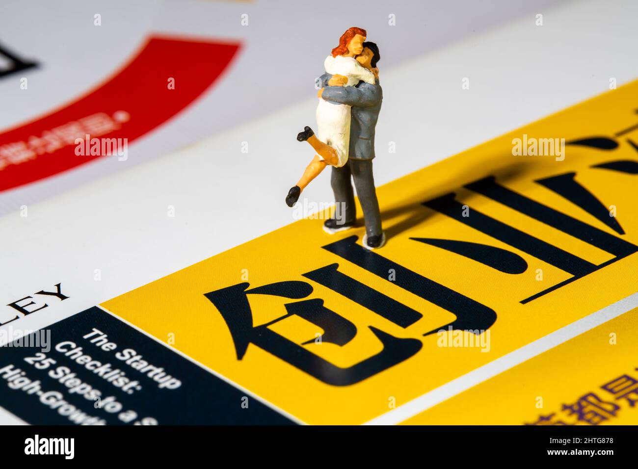 Miniature figures of lovely hugging couple Stock Photo - Alamy