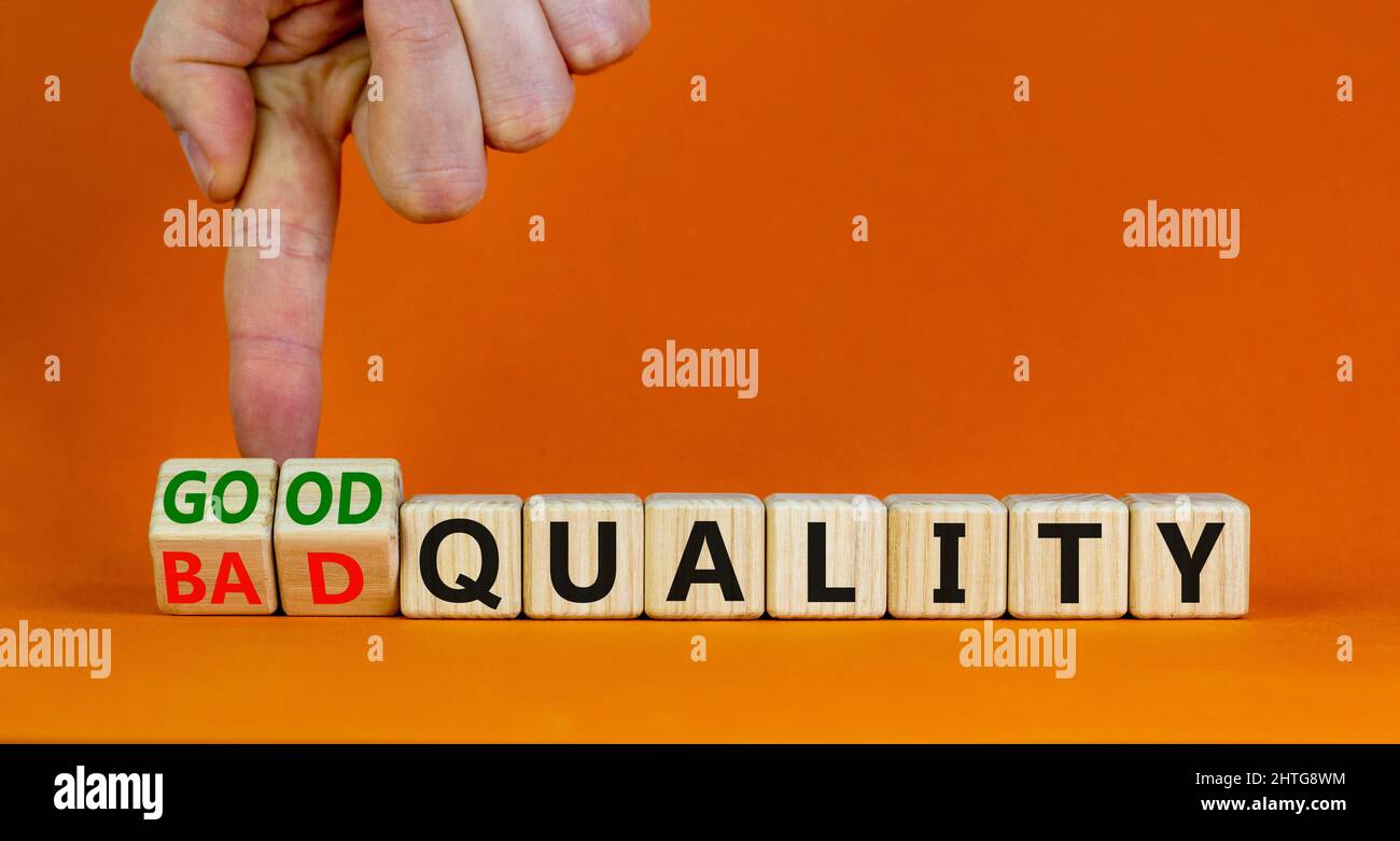 Good or bad quality symbol. Businessman turns cubes and changes words ...