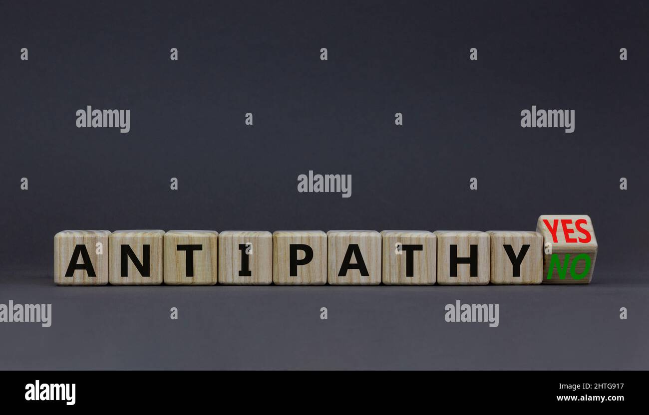 Antipathy yes or no symbol. Psychologist turns a wooden cube and change ...