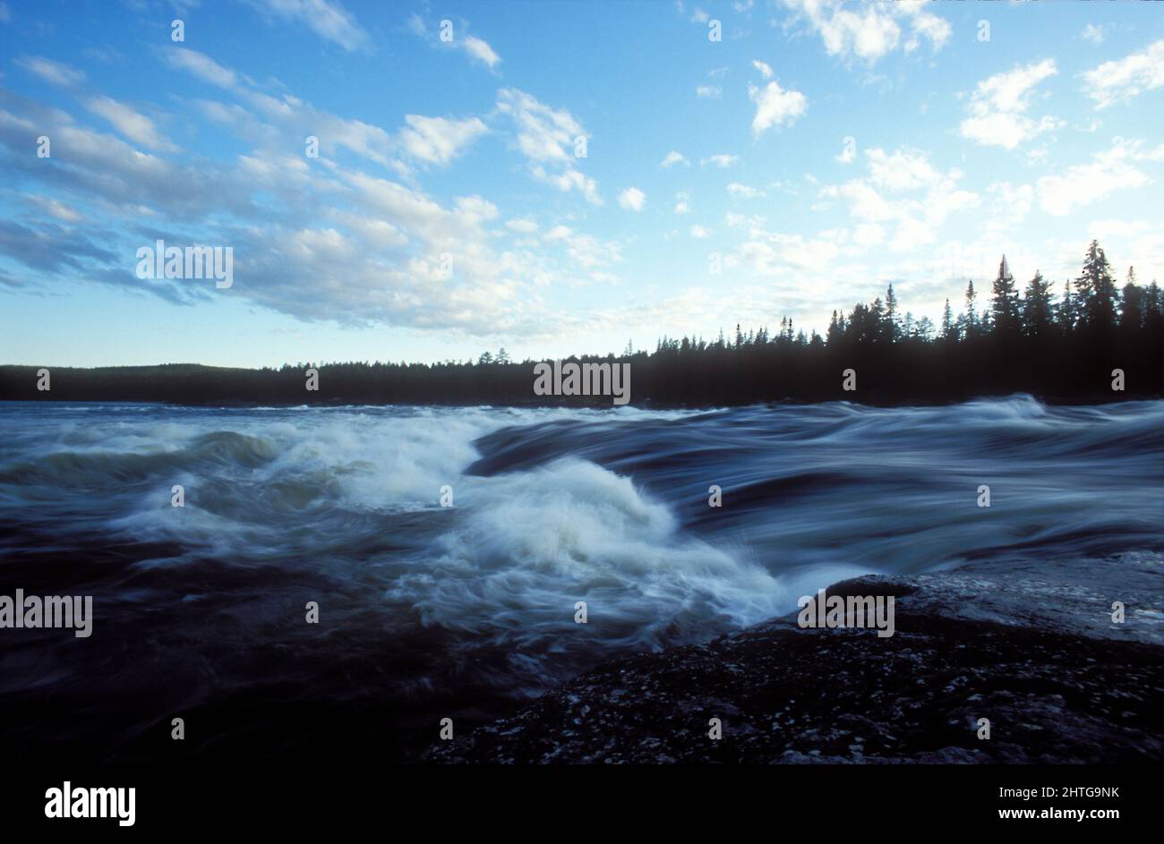 Wild river rapids in the country in 2005, analog. Fast, strong, and ...