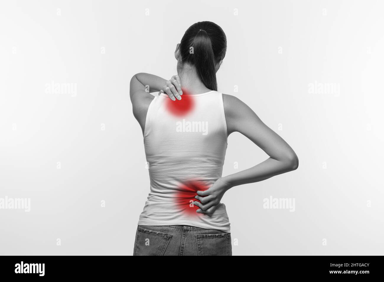 Back view of lady rubbing painful sore neck and back Stock Photo - Alamy