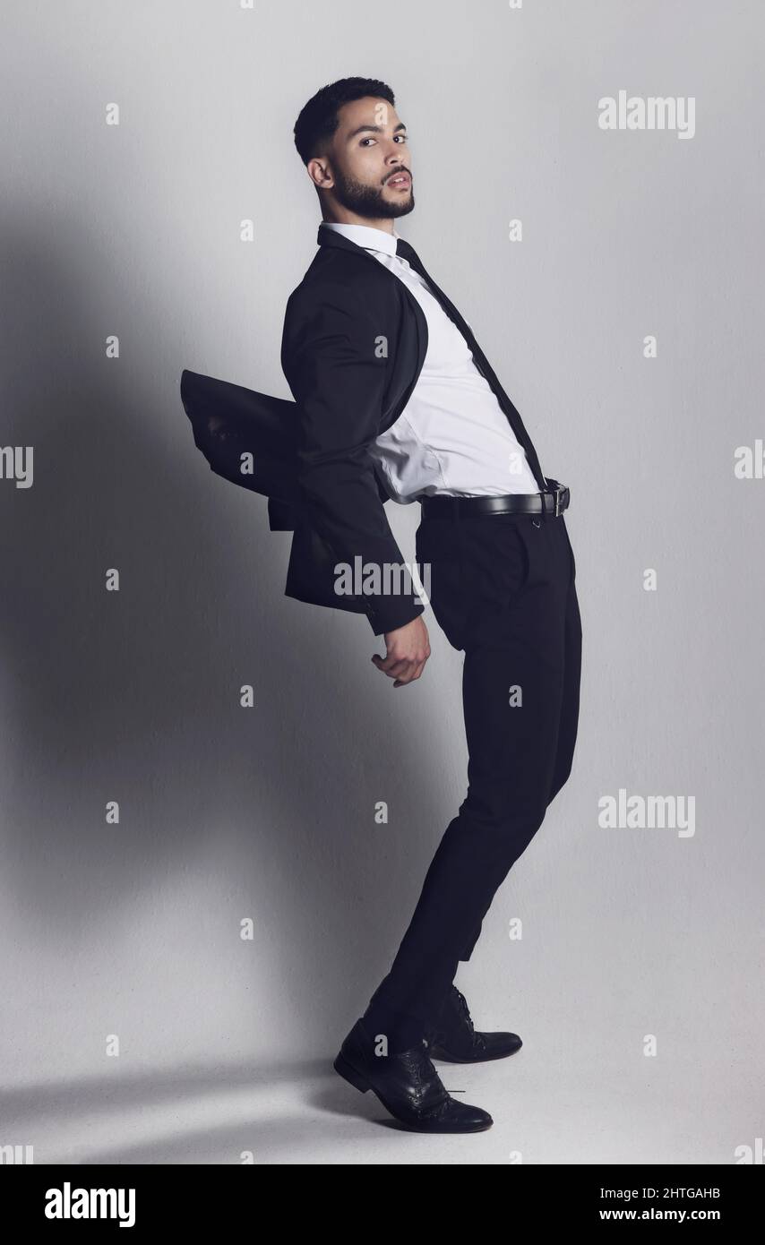 Dodging your negativity. Studio shot of a young man posing against a ...