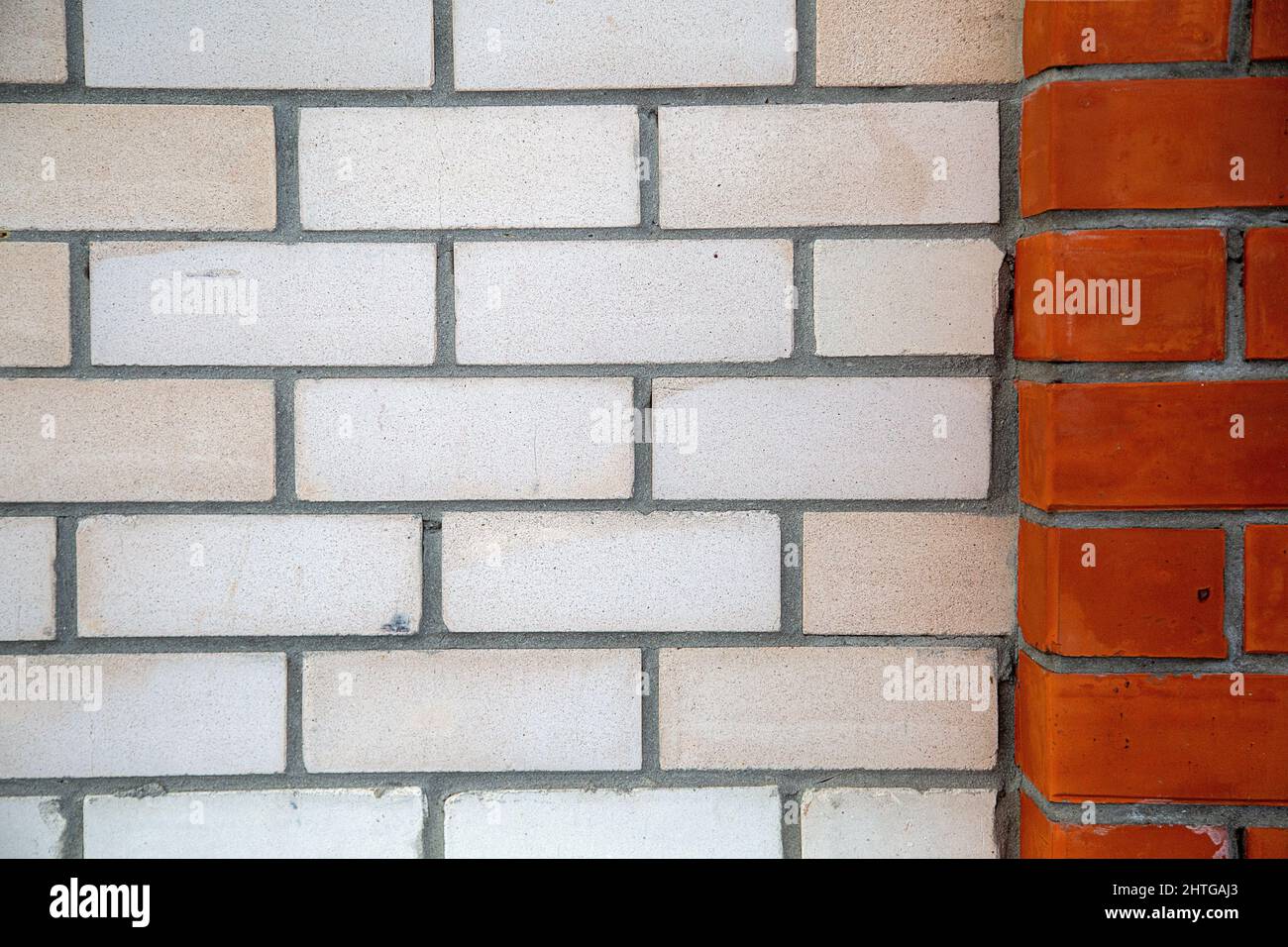 background with red and white brick masonry Stock Photo - Alamy