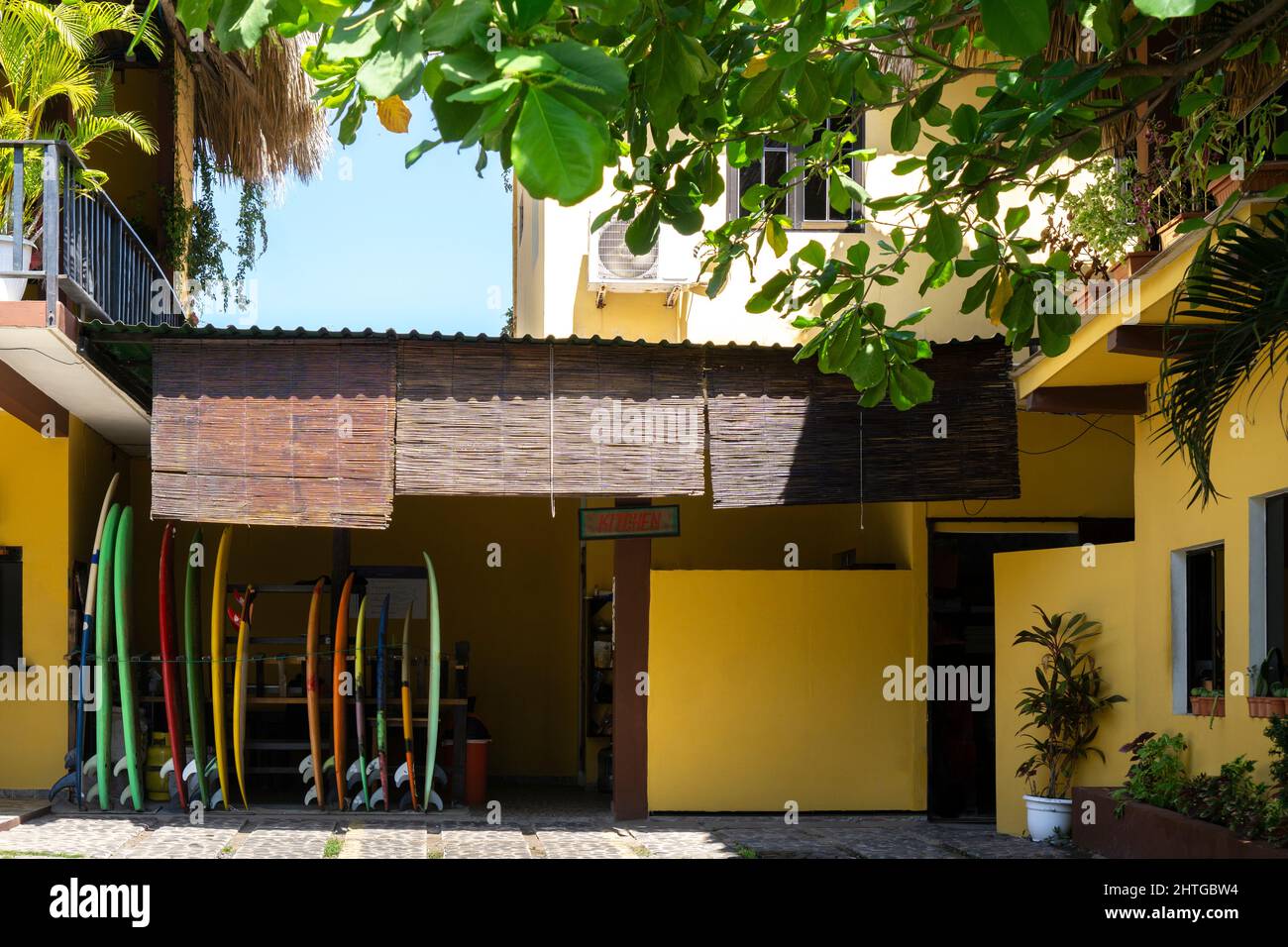 Stack of surfboards in a building for rent or sell on a sunny day Stock ...