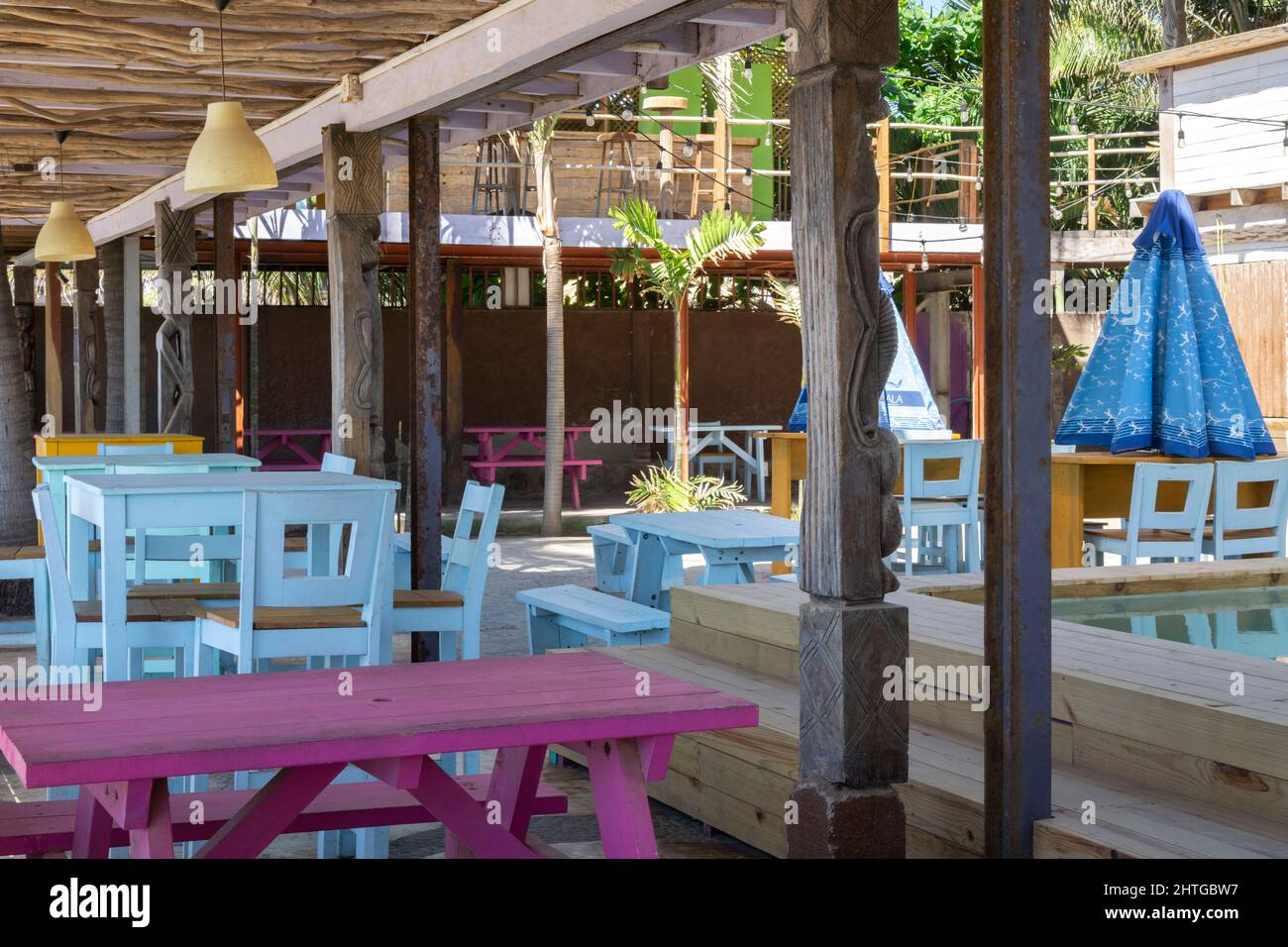 Outdoor seating area of a restaurant. Terrace or patio with chairs and ...
