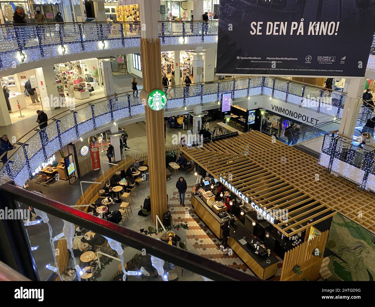 View of Starbucks cafe with customers in Oslo City inside a shopping ...