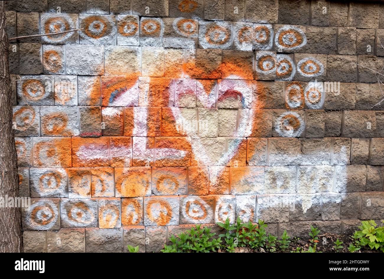 Graffiti art work of 1 heart on a brick wall along the Midtown Greenway ...