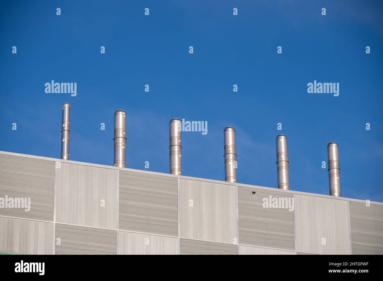 Exhaust pipes on the roof of a modern building Stock Photo - Alamy