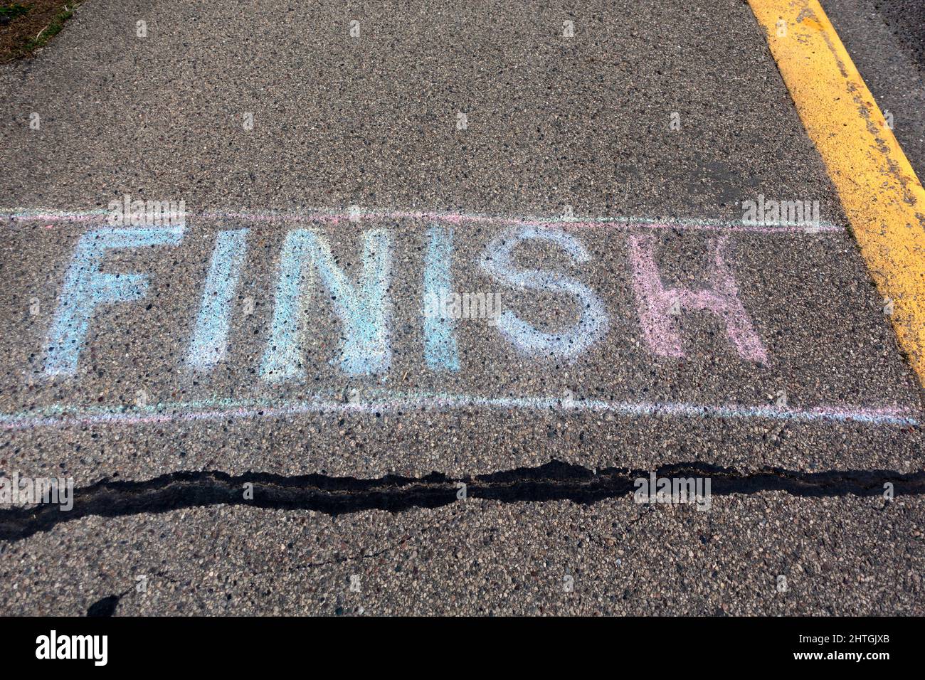 Chalk writing in the street acknowledging an event finish line. St Paul ...