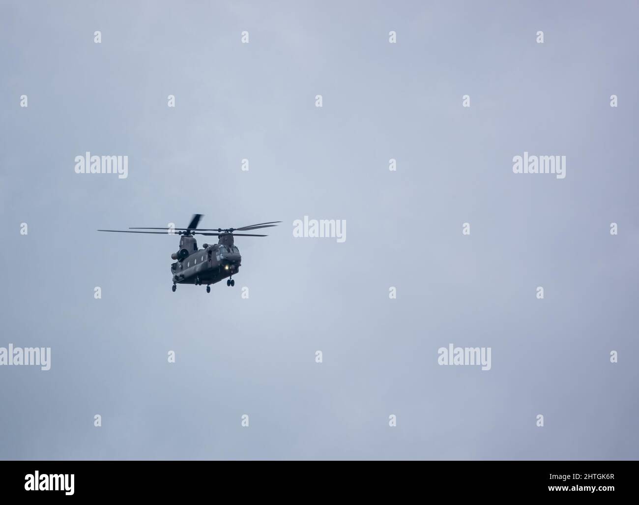 RAF Chinook tandem-rotor CH-47 helicopter flying fast and low in a ...