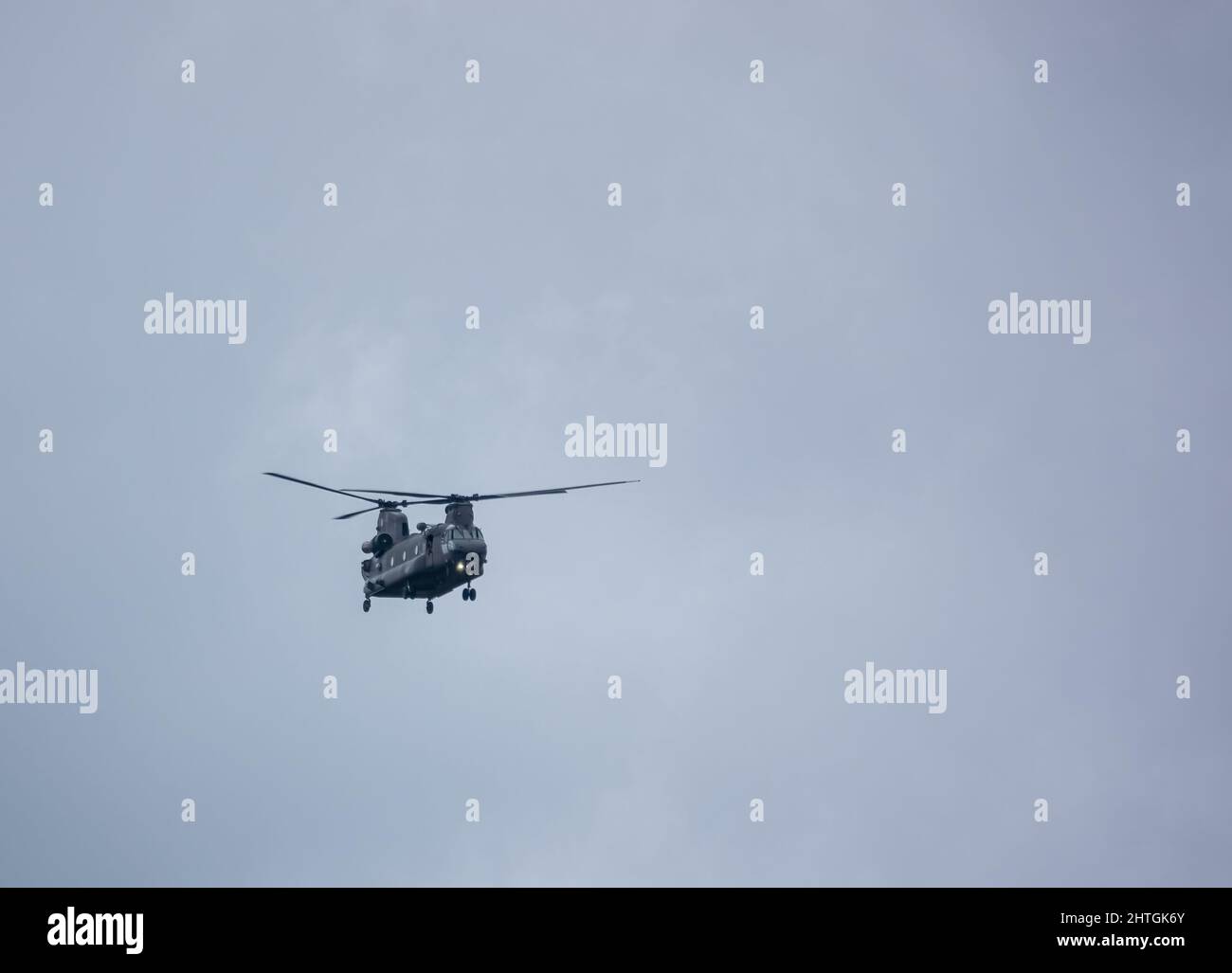 RAF Chinook tandem-rotor CH-47 helicopter flying fast and low in a ...