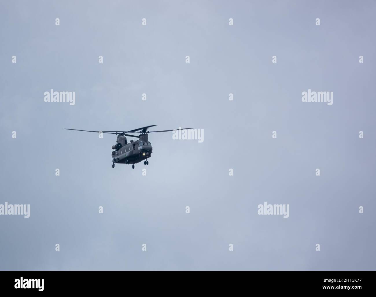 RAF Chinook tandem-rotor CH-47 helicopter flying fast and low in a ...