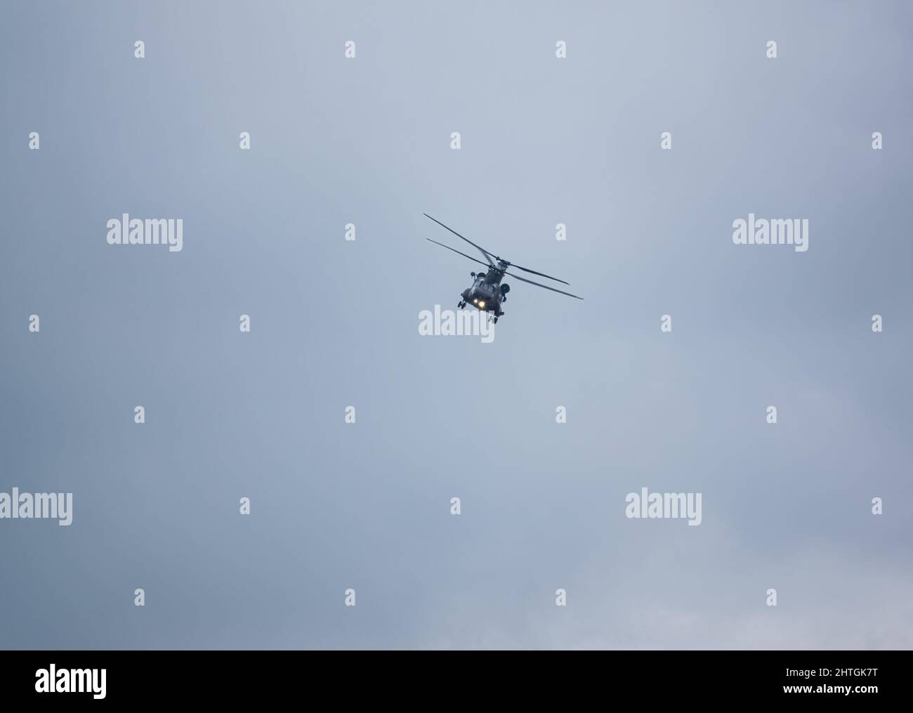 RAF Chinook tandem-rotor CH-47 helicopter flying fast and low in a ...