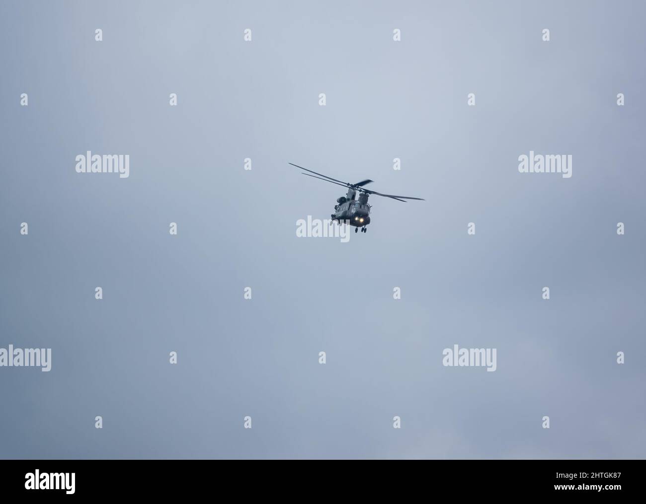 RAF Chinook tandem-rotor CH-47 helicopter flying fast and low in a ...