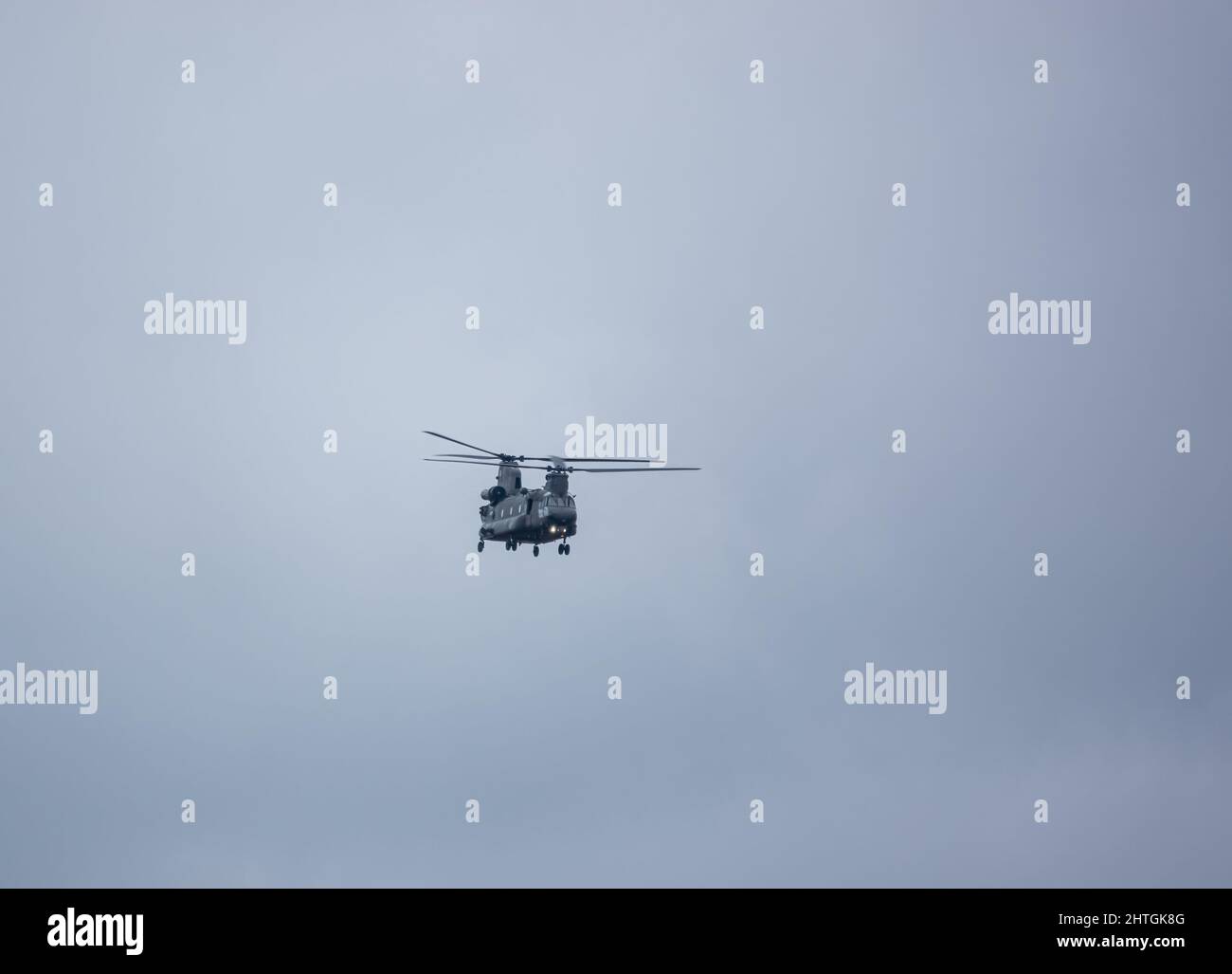 RAF Chinook tandem-rotor CH-47 helicopter flying fast and low in a ...