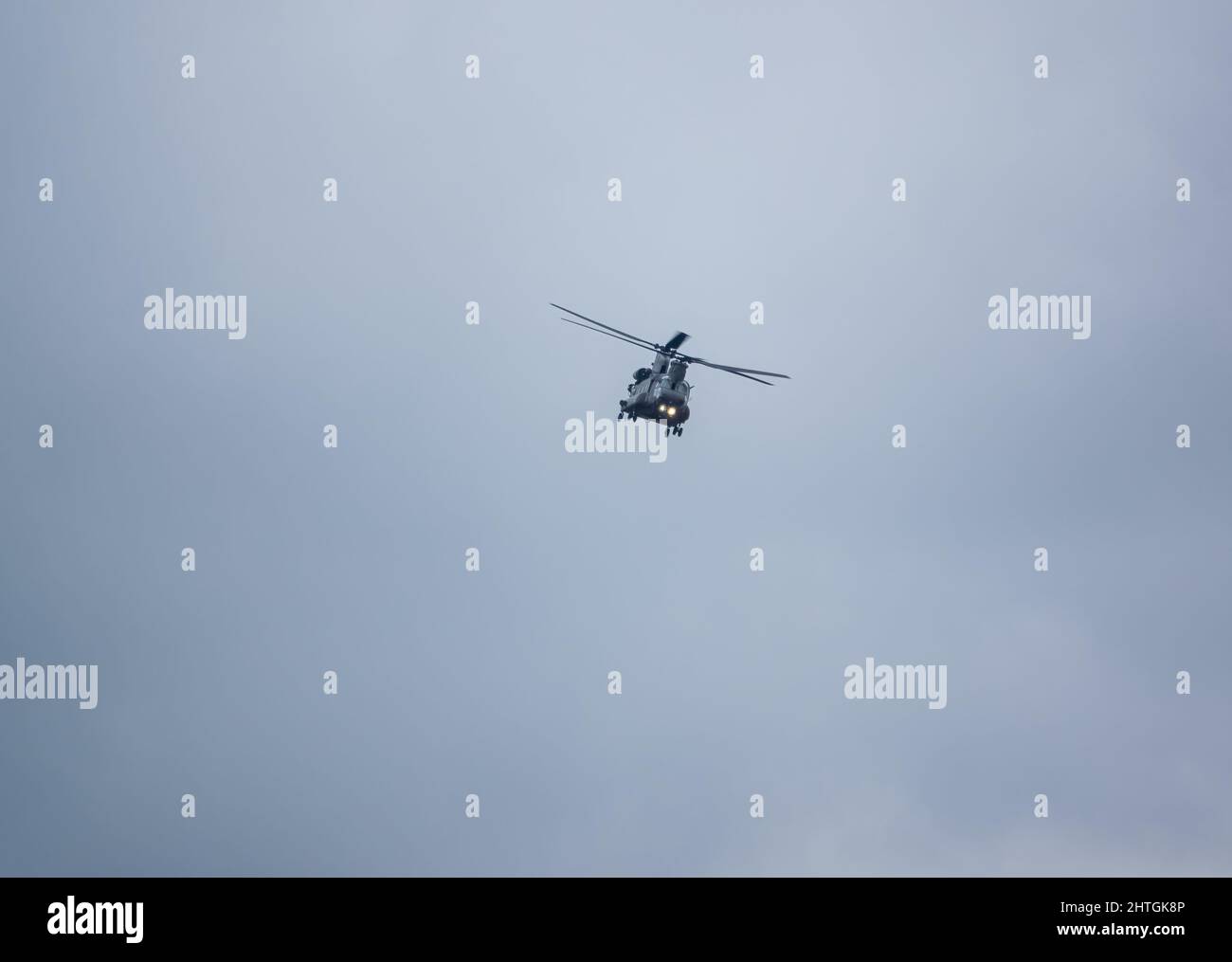 RAF Chinook tandem-rotor CH-47 helicopter flying fast and low in a ...
