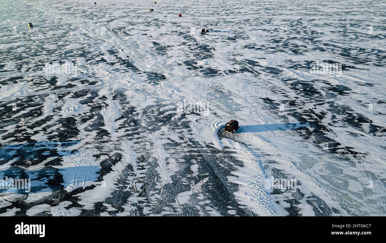 Aerial of frozen lake with patterns and fishing Stock Photo - Alamy