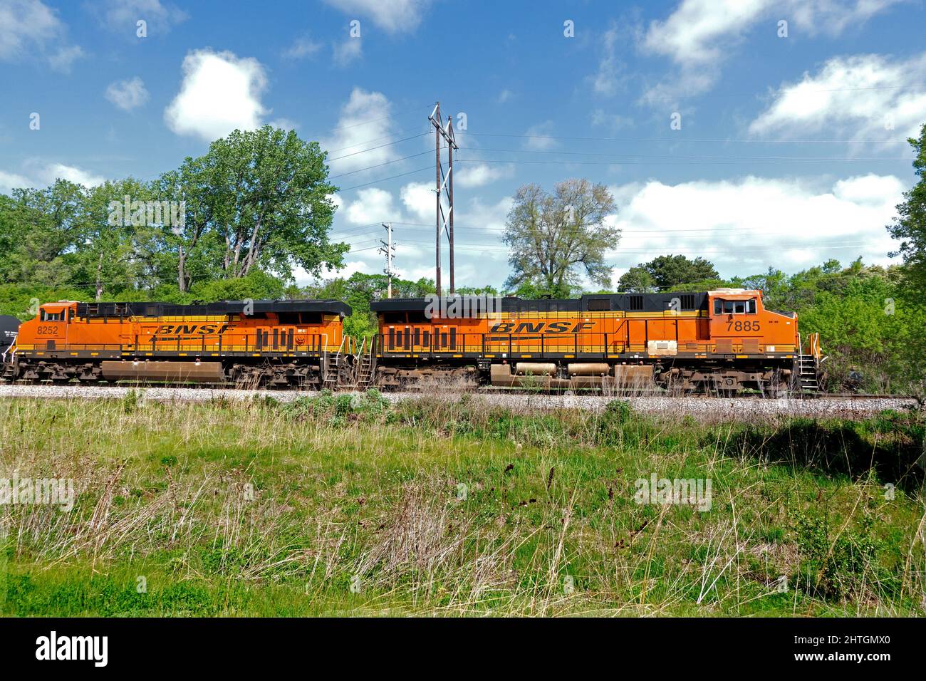 Powerful double engine BNSF train moving along the tracks pulling ...
