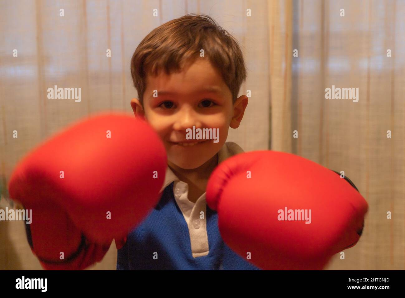 smiling boy with red boxing gloves Stock Photo - Alamy