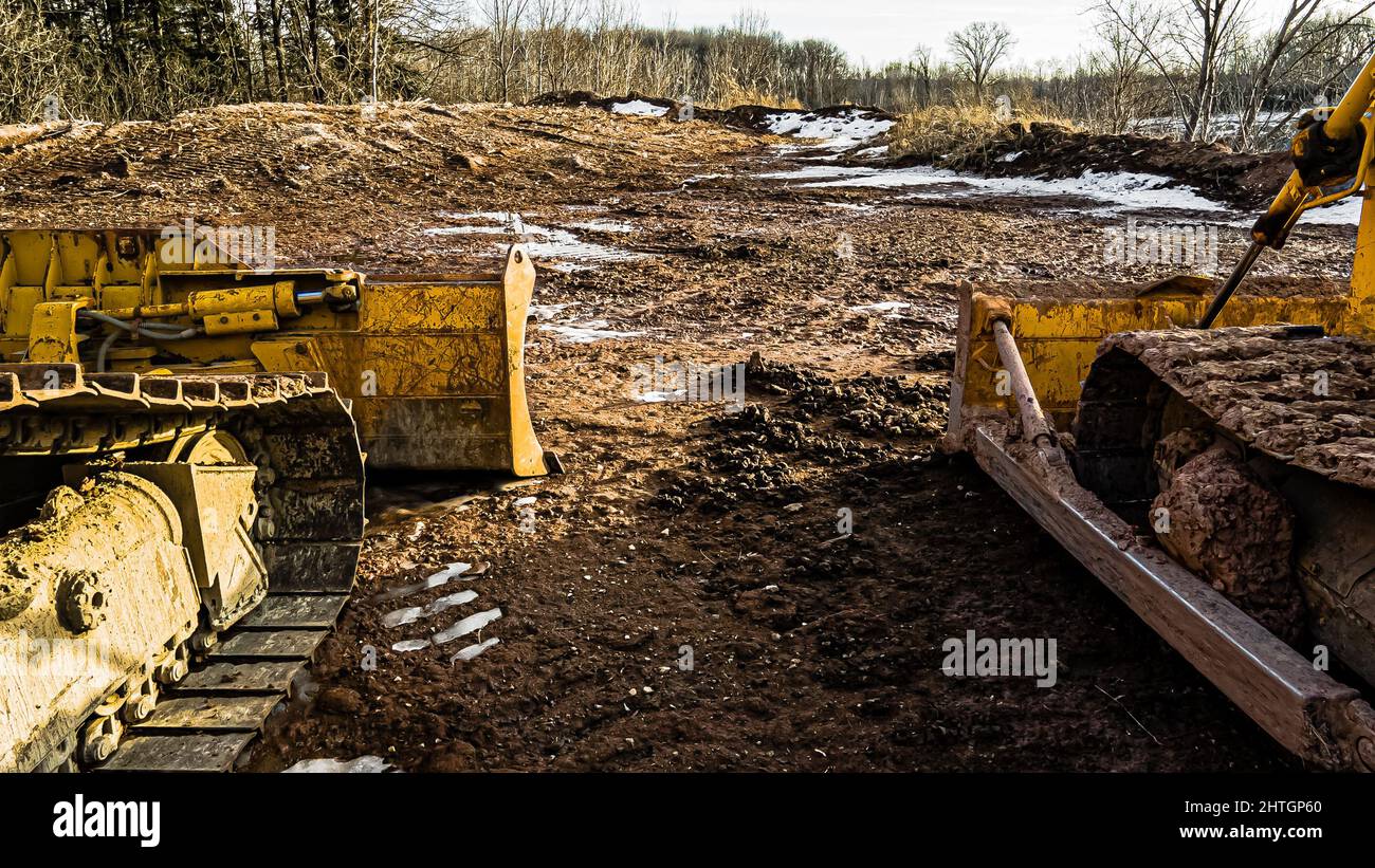 Regardless of season the machines are hard at work covered in mud Stock ...