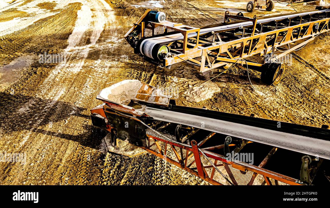 Open pit rock quarry with stone traveling on conveyors to piles Stock ...