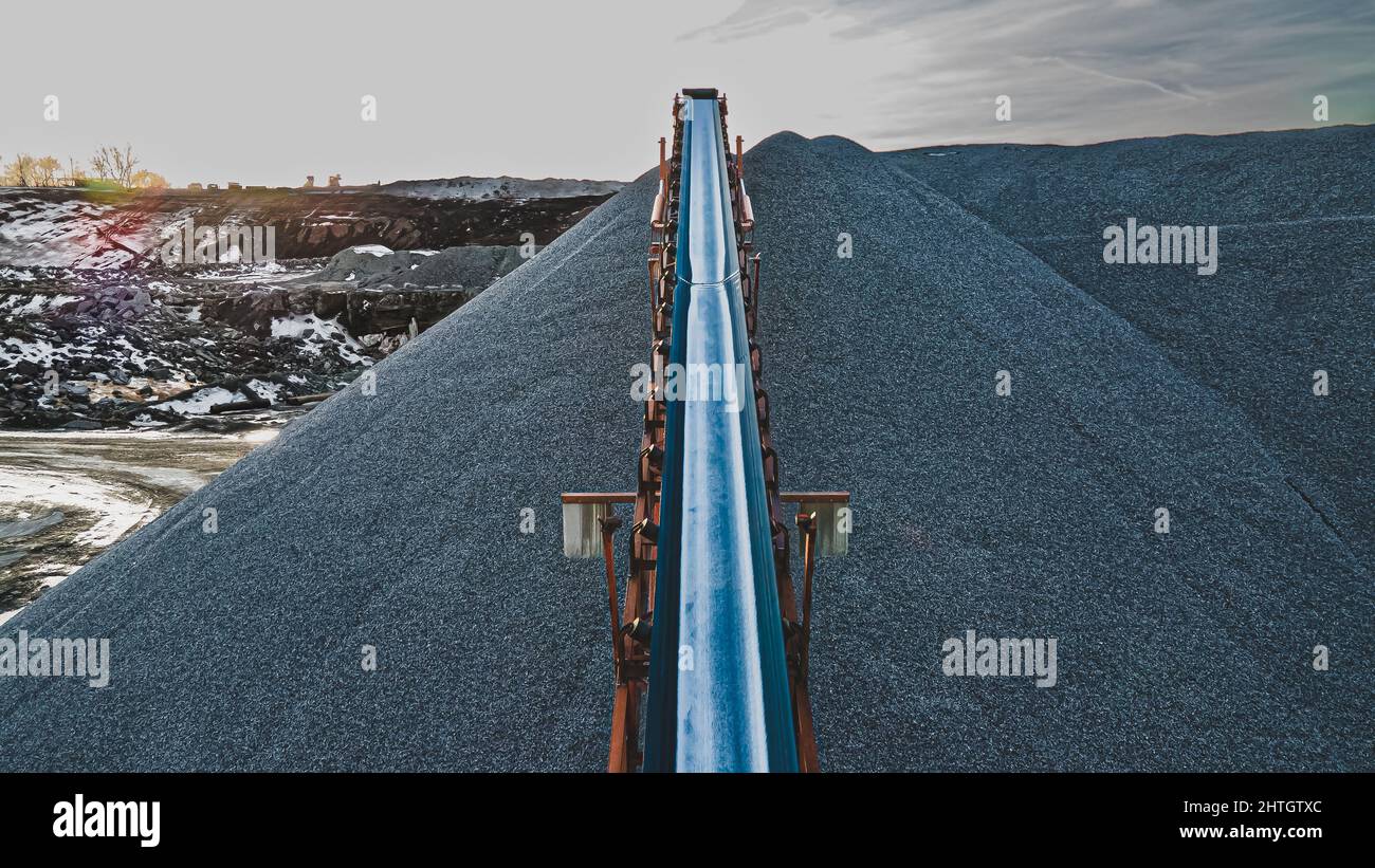 Open pit rock quarry with stone traveling on conveyors to piles Stock ...