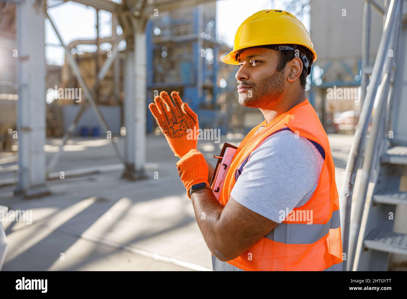 Man worker dressed in reflective hi-res stock photography and images ...