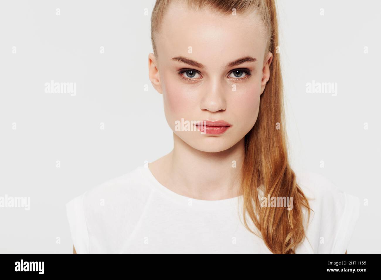 Simplicity is the ultimate sophistication. Portrait of a beautiful young woman standing in a ...