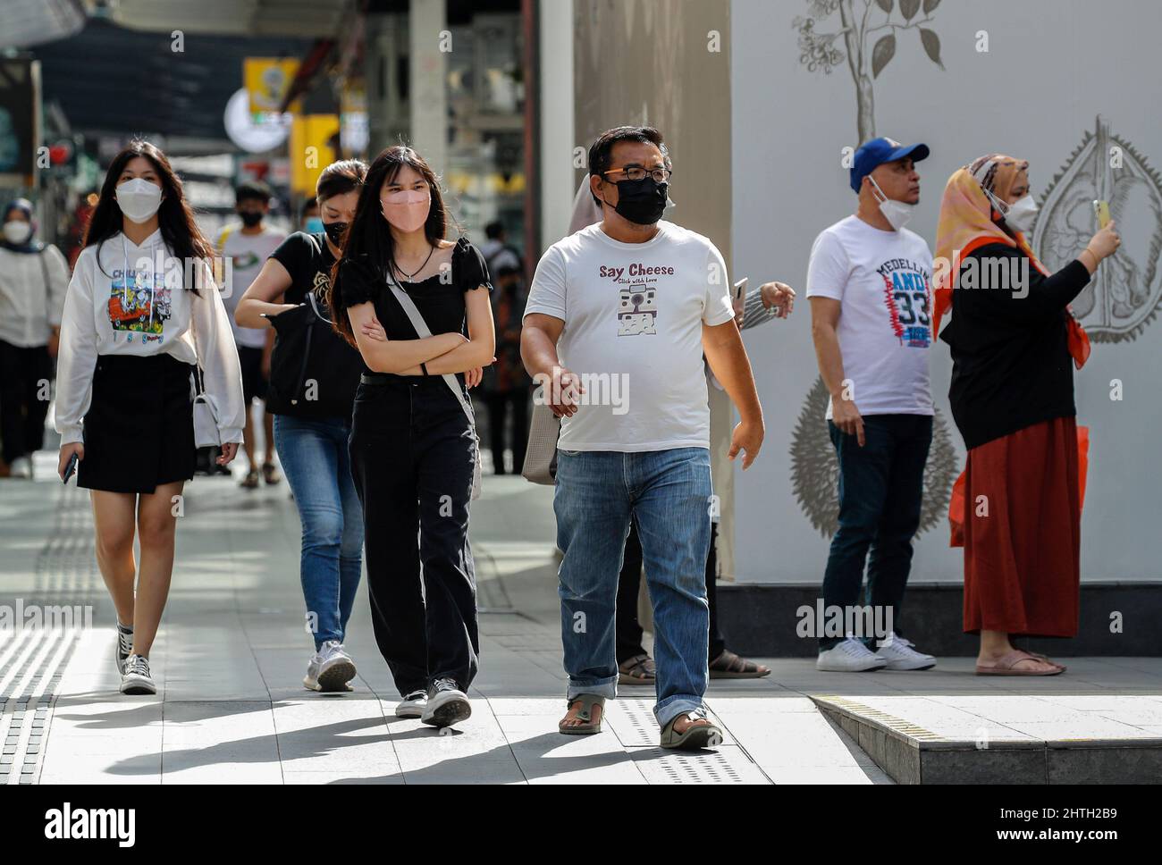 Pedestrians wearing face masks as a preventive measure against the ...
