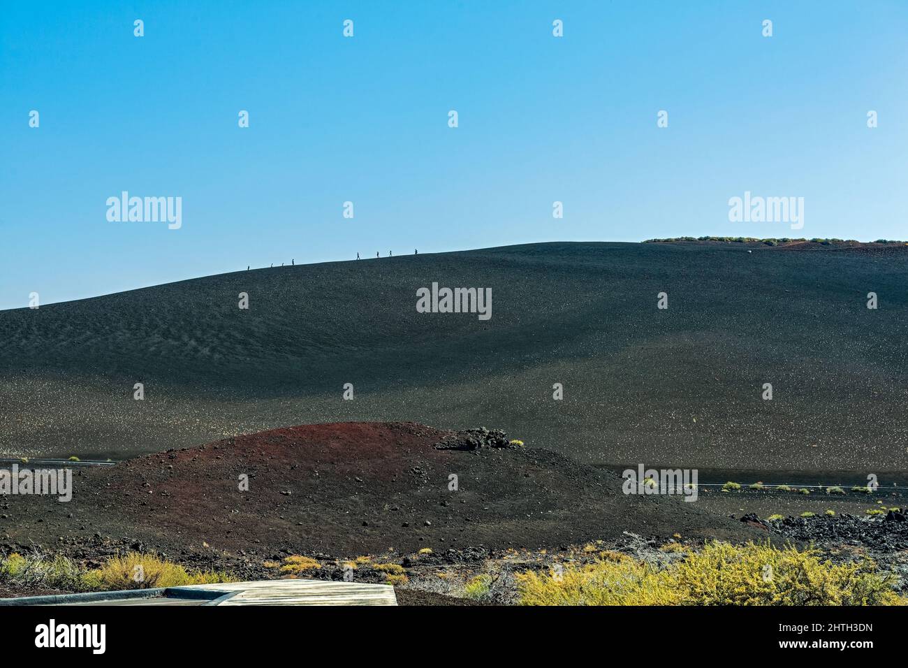 Hikers on top of the Inferno Cone at Craters of the Moon National ...