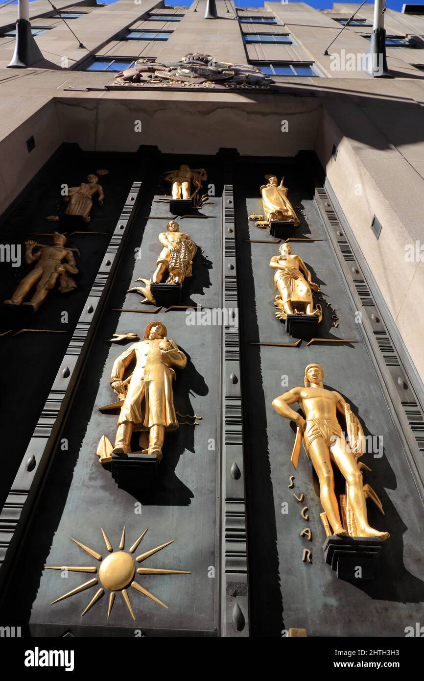 Golden statues depicting trades decorated the door on 30 Rockefeller ...