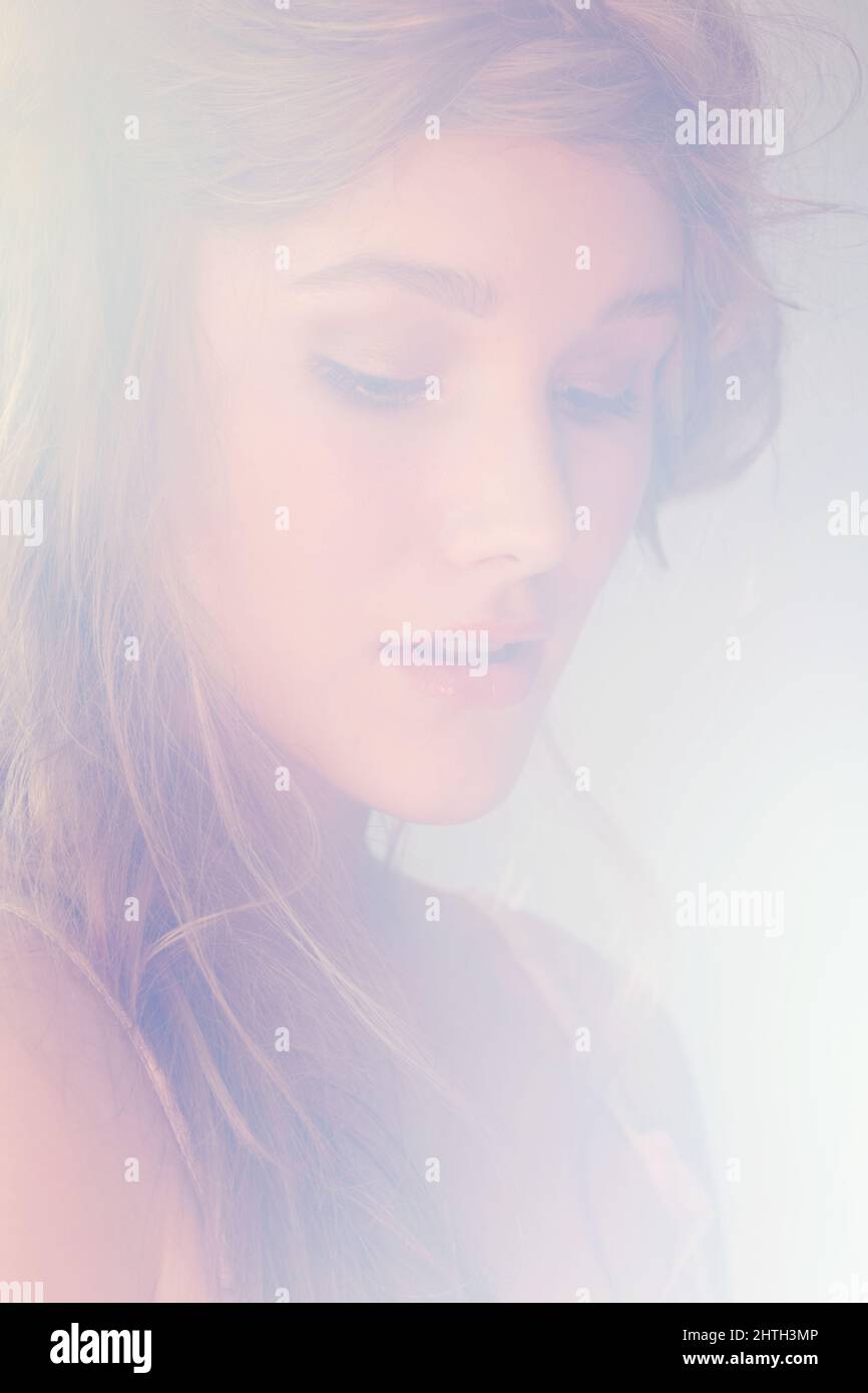 Dream-like beauty. A beautiful model looking down Stock Photo - Alamy