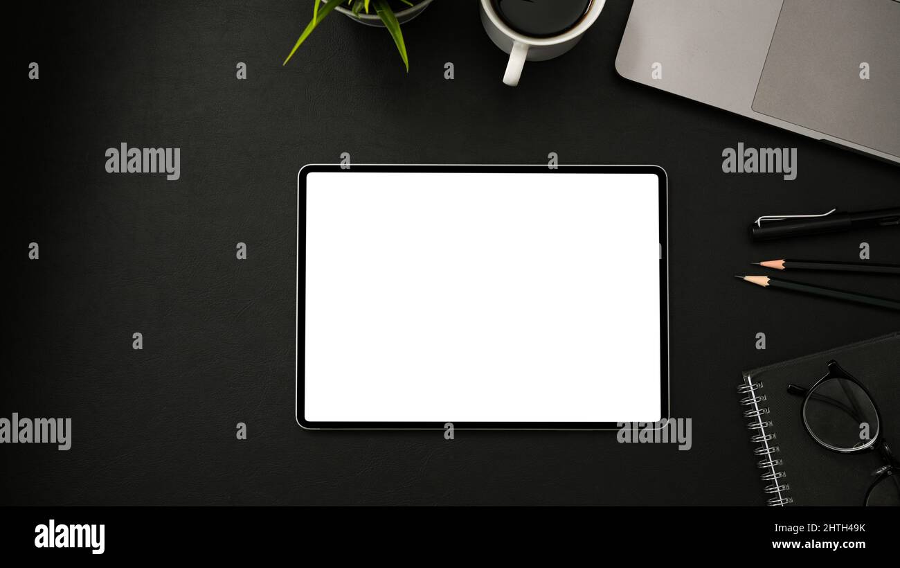 Dark workspace with wireless tablet mockup include clipping path ...