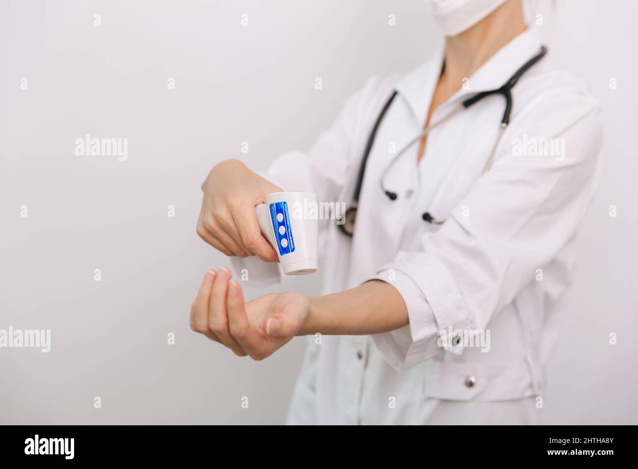 Temperature measurement gun in doctor hands. Close-up shot of doctor ...
