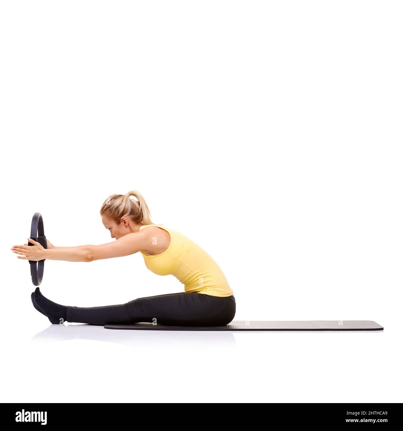 Extending herself. A pretty young blonde performing the roll up ...