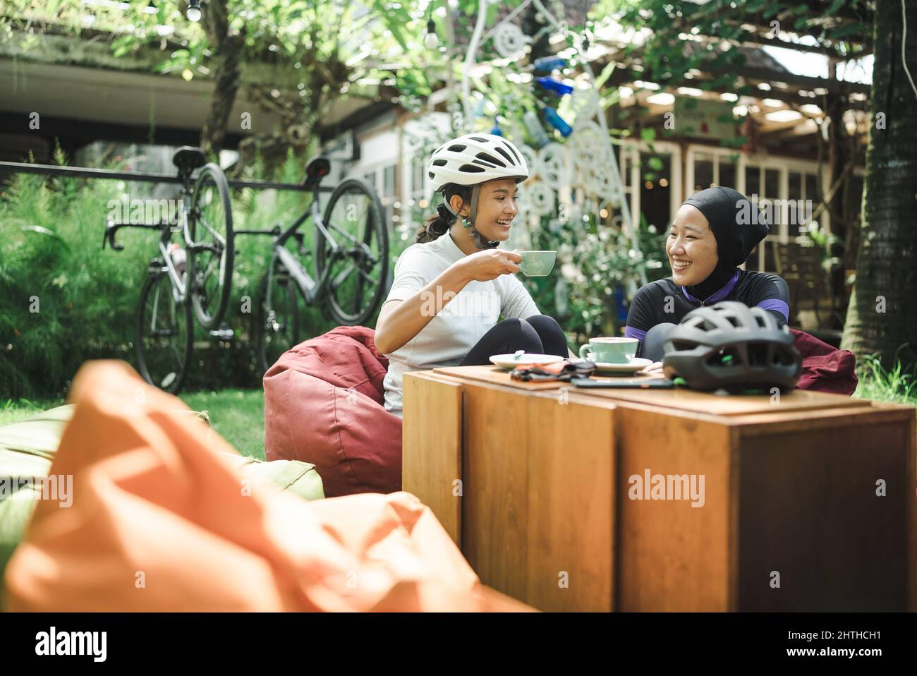 beautiful cyclist having a tea break after long ride Stock Photo - Alamy