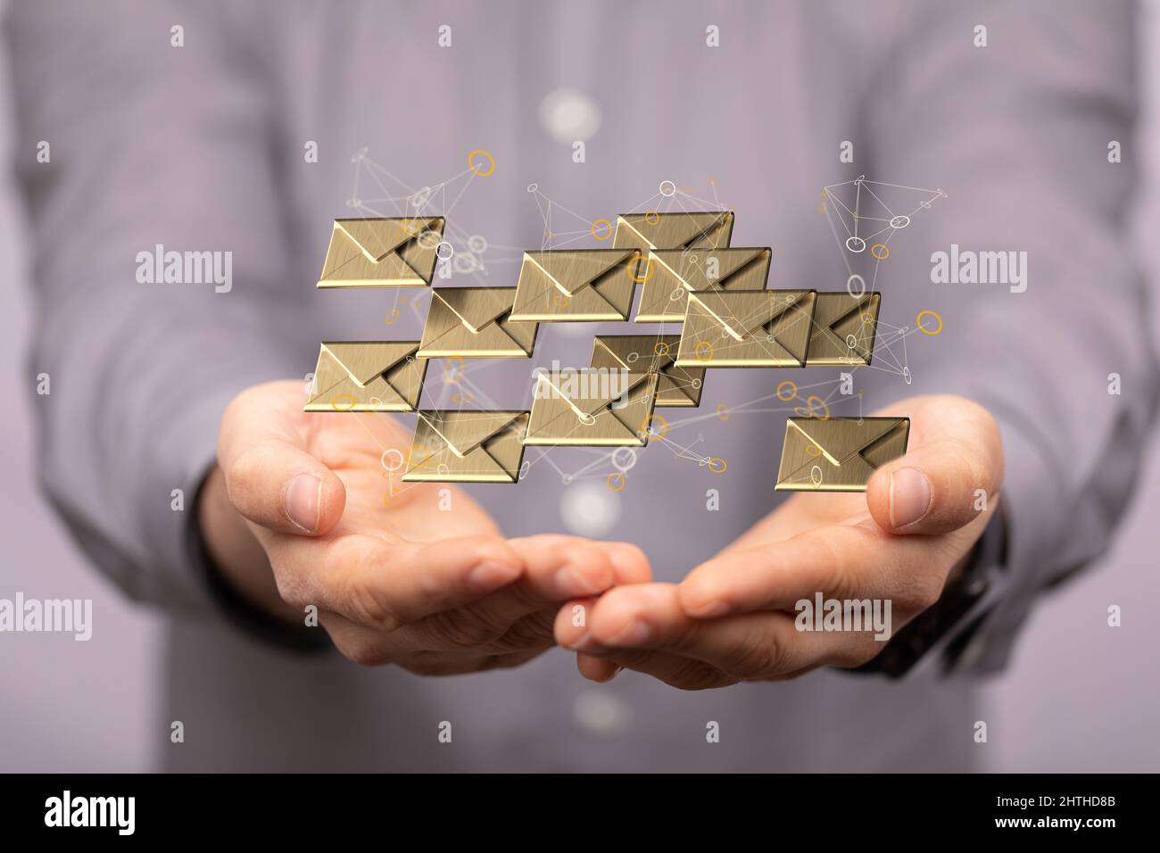 3D rendering of floating email icons between hands Stock Photo - Alamy