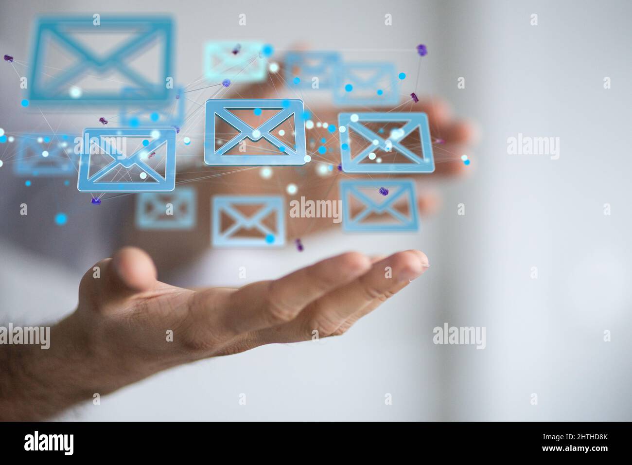 3D rendering of floating email icons between hands Stock Photo - Alamy