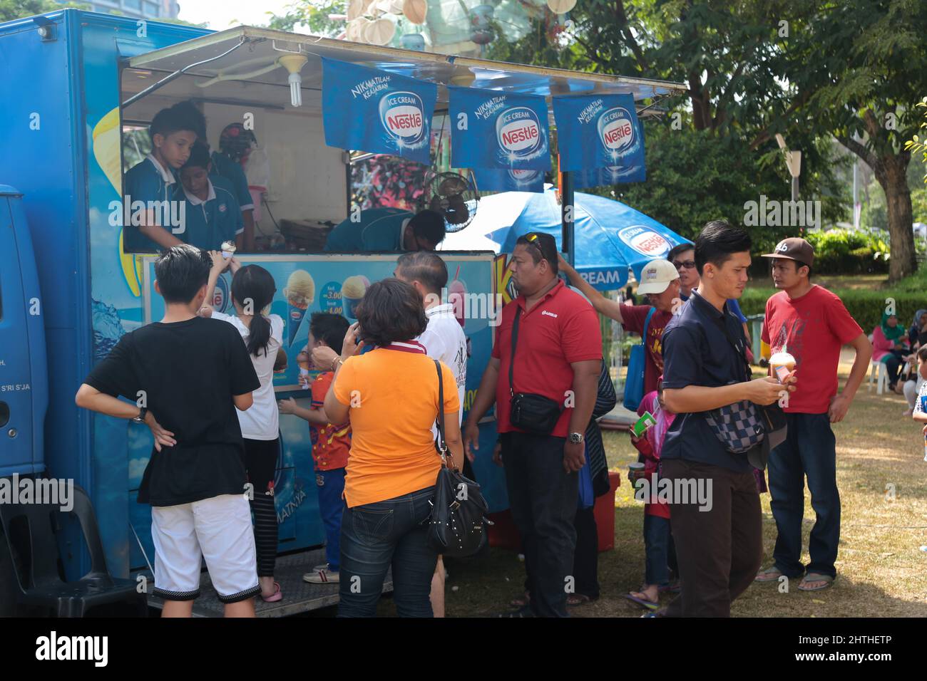 People craving for ice cream are queueing up in front the ice cream ...