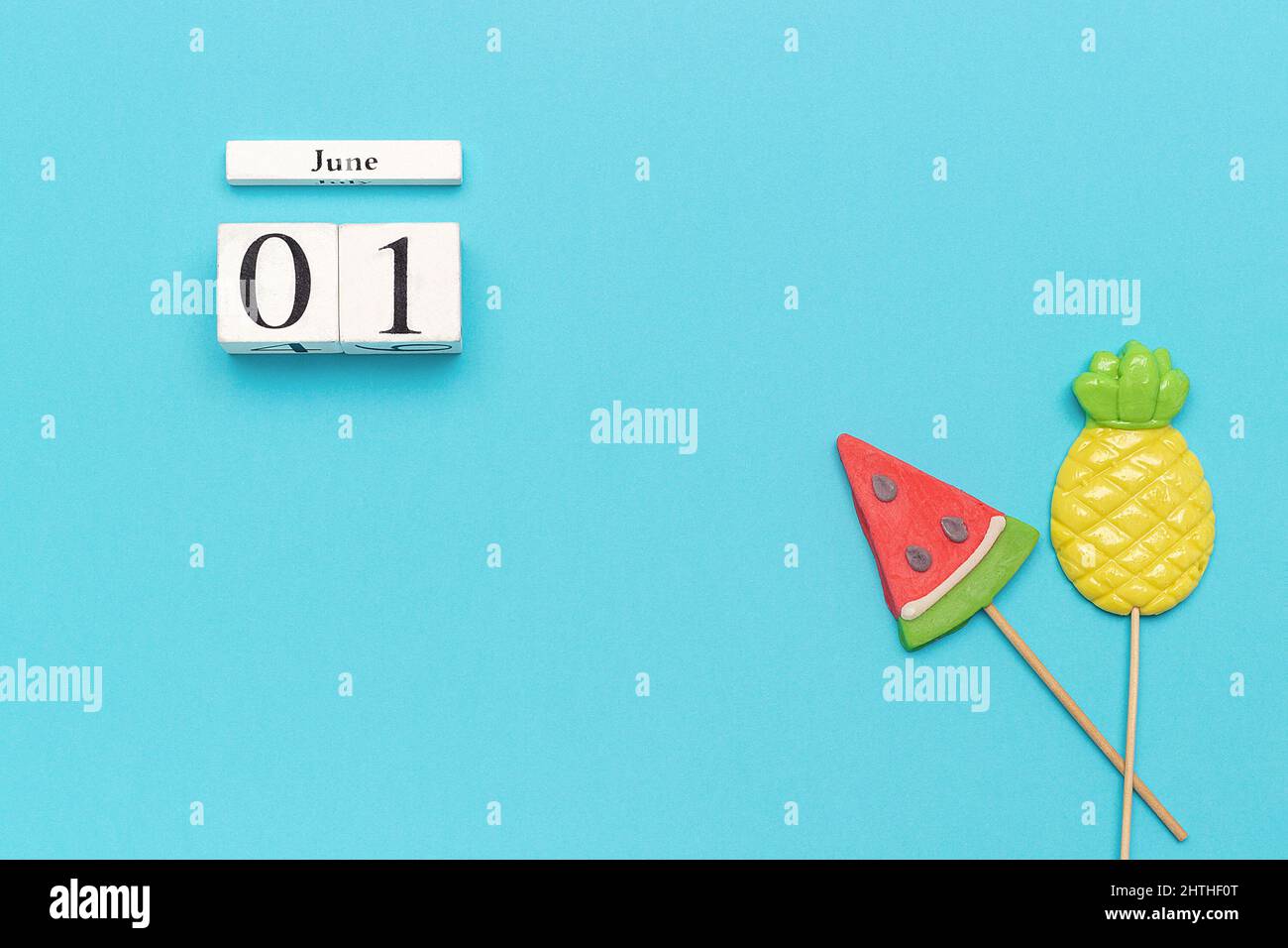 Wooden cubes calendar June 1. Summer fruits pineapple, watermelon on ...