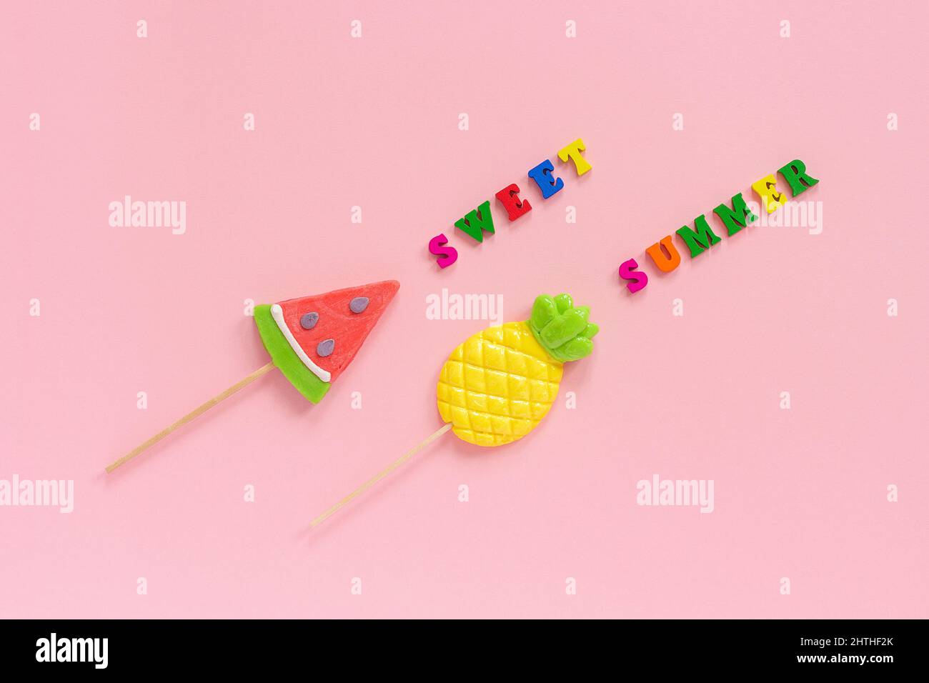Sweet summer text, Pineapple and watermelon lollipops on pink ...